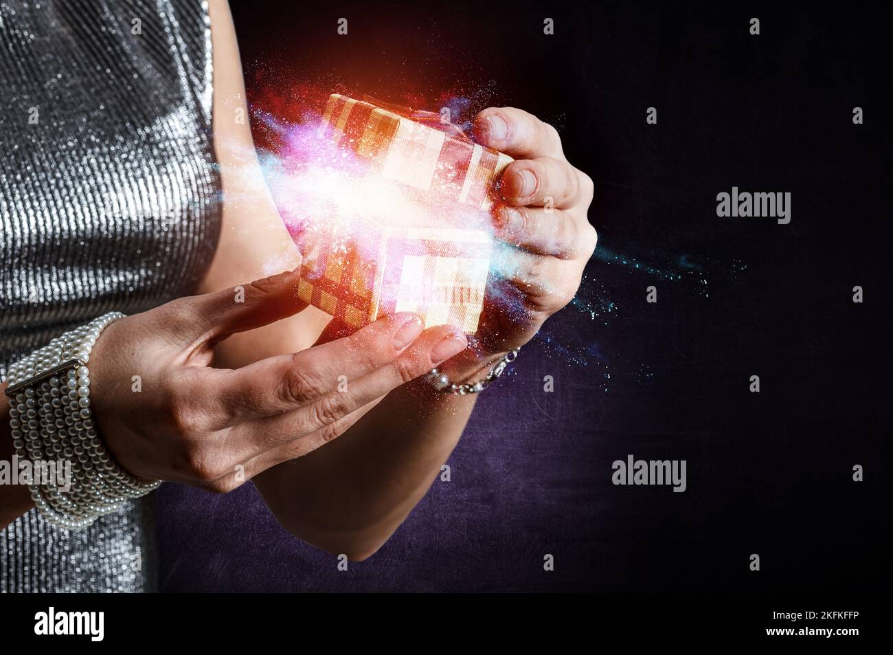 Closeup hands giving surprise gift box Stock Photo - Alamy
