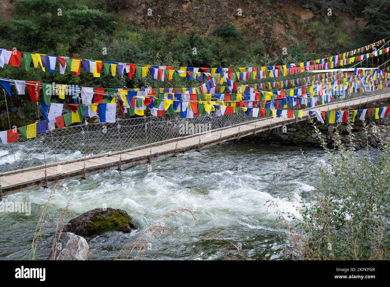 Prayer Flags Hanging On A Bridge in Bhutan Stock Photo - Alamy