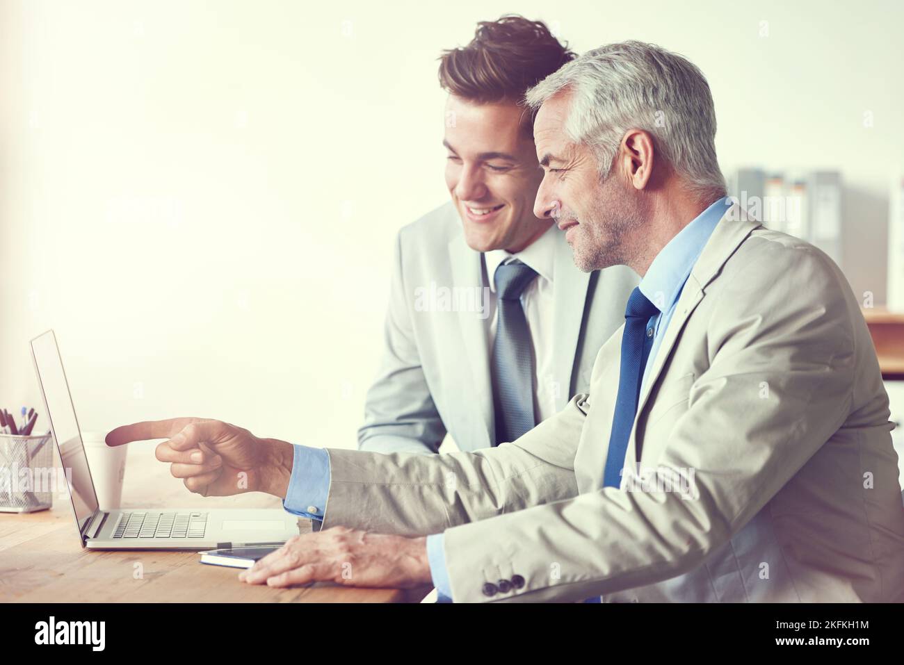 Two business people comparing notes hi-res stock photography and images ...