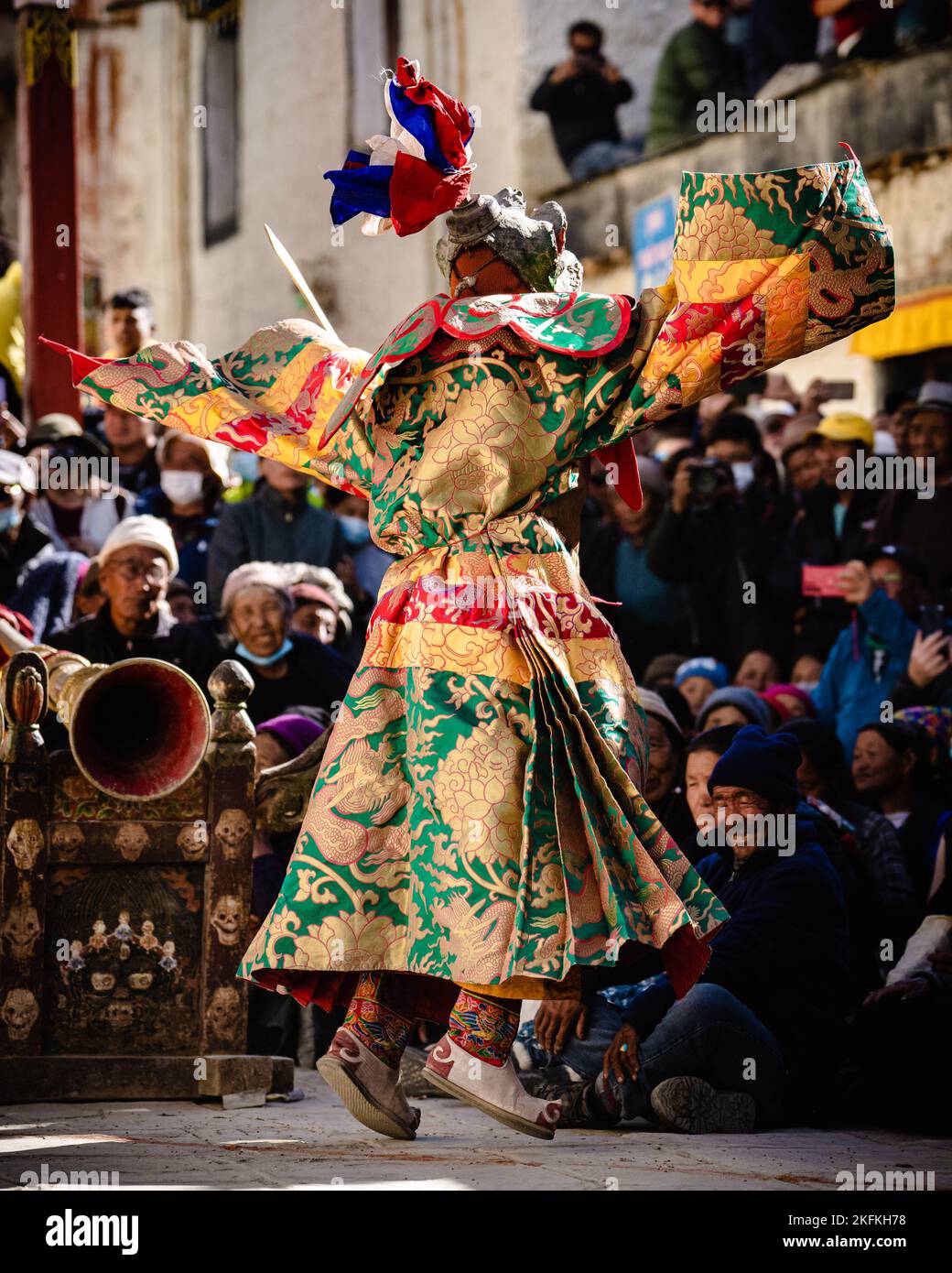 A Tibetan Buddhist dancer in traditional demon spirit ghost clothing in ...
