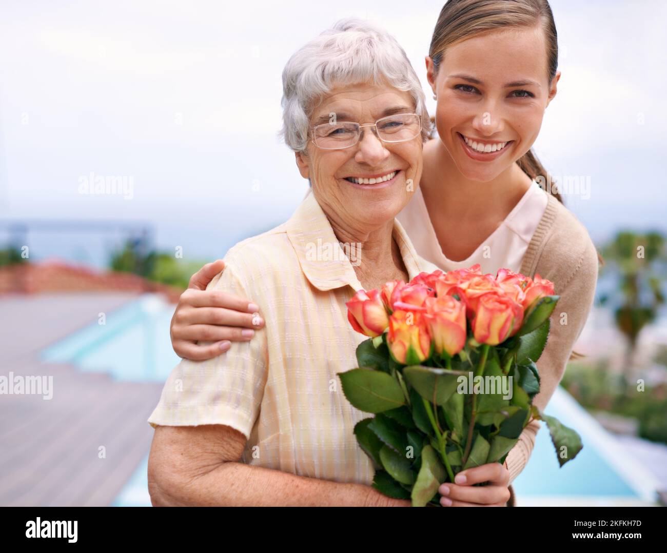 Appreciating all that shes done for me. a young woman giving her mother ...