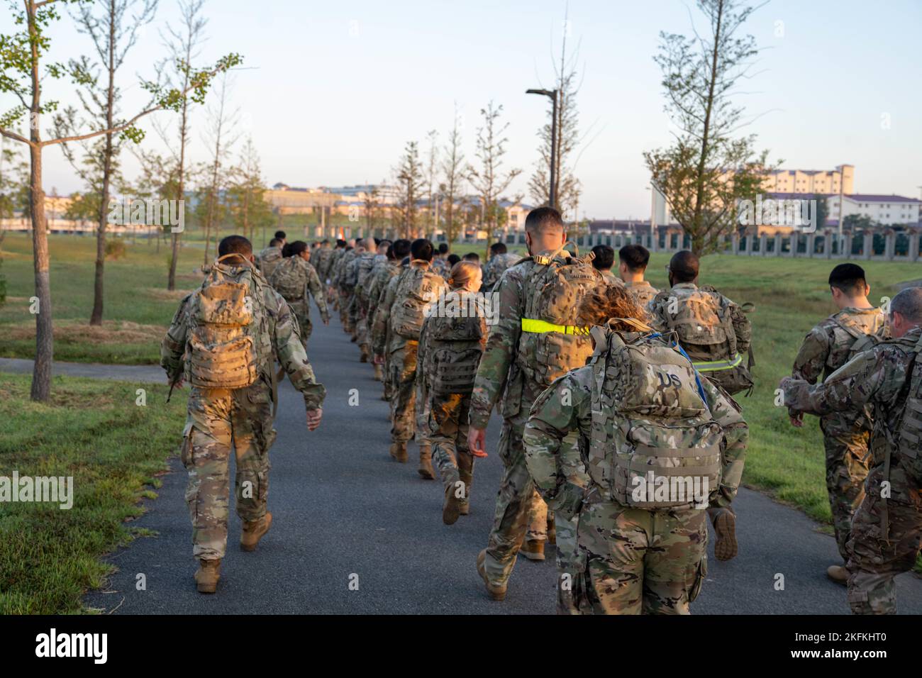 Soldiers in Headquarters Company participate in a ruck march for their ...