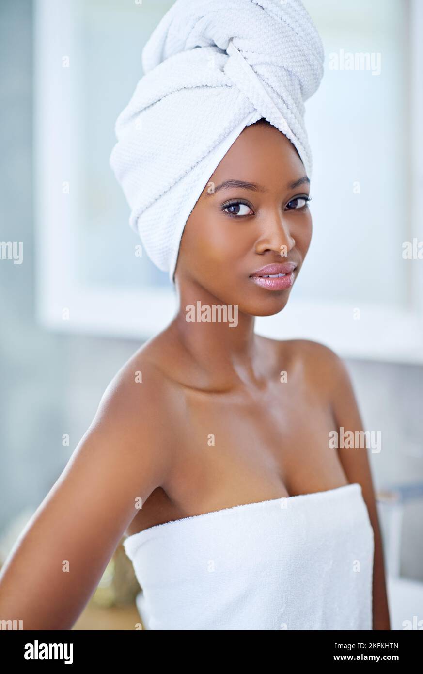 Shes all about skin care. a beautiful young woman during her daily ...