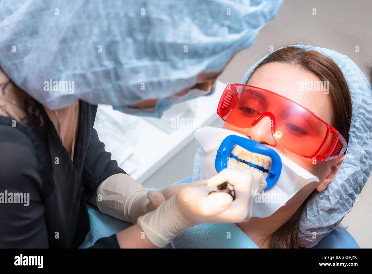 there is a preparation of the oral cavity to bleaching with the help of ...