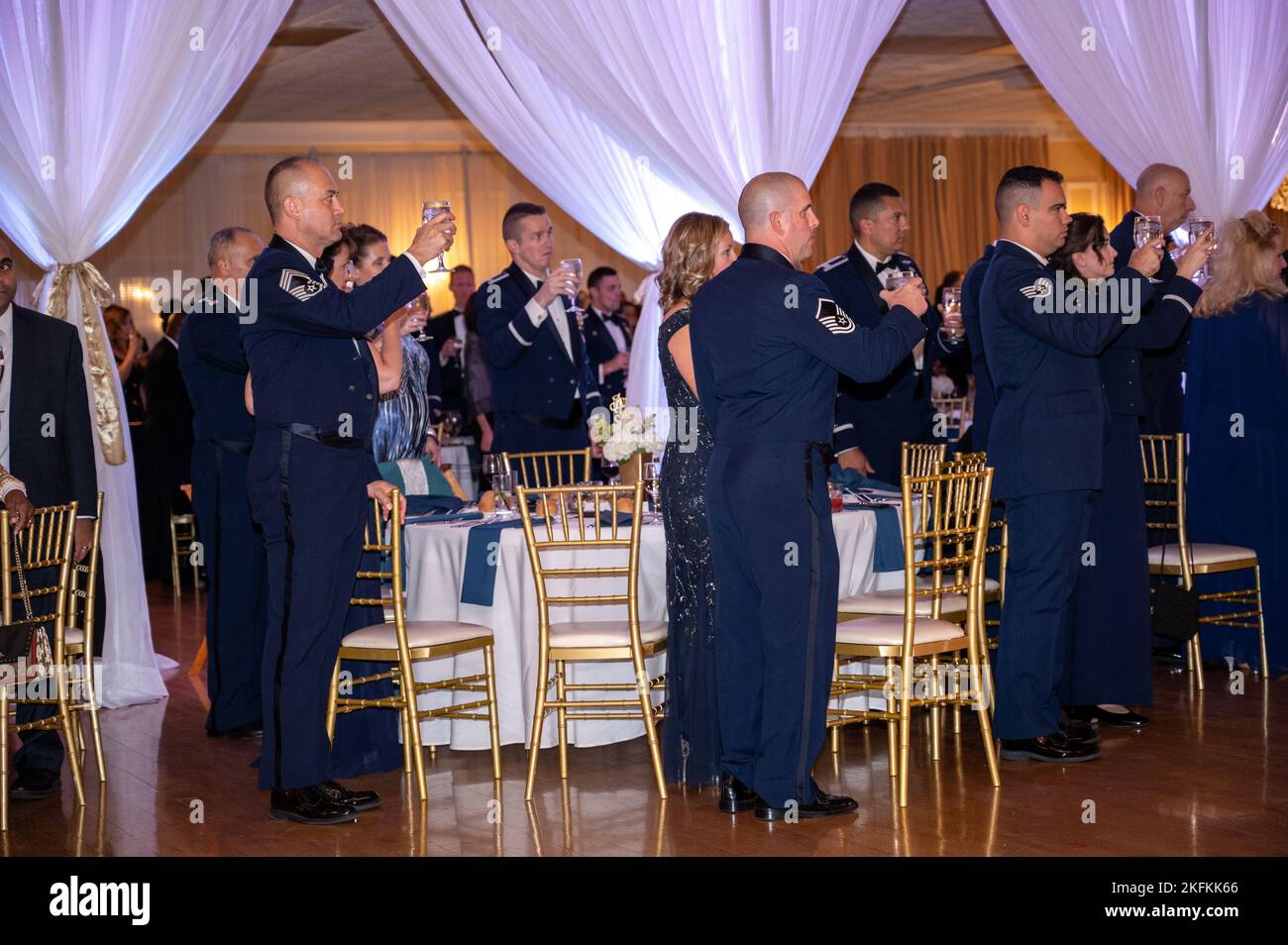 U.S. Air Force Airmen and their guests give a toast during the Air ...