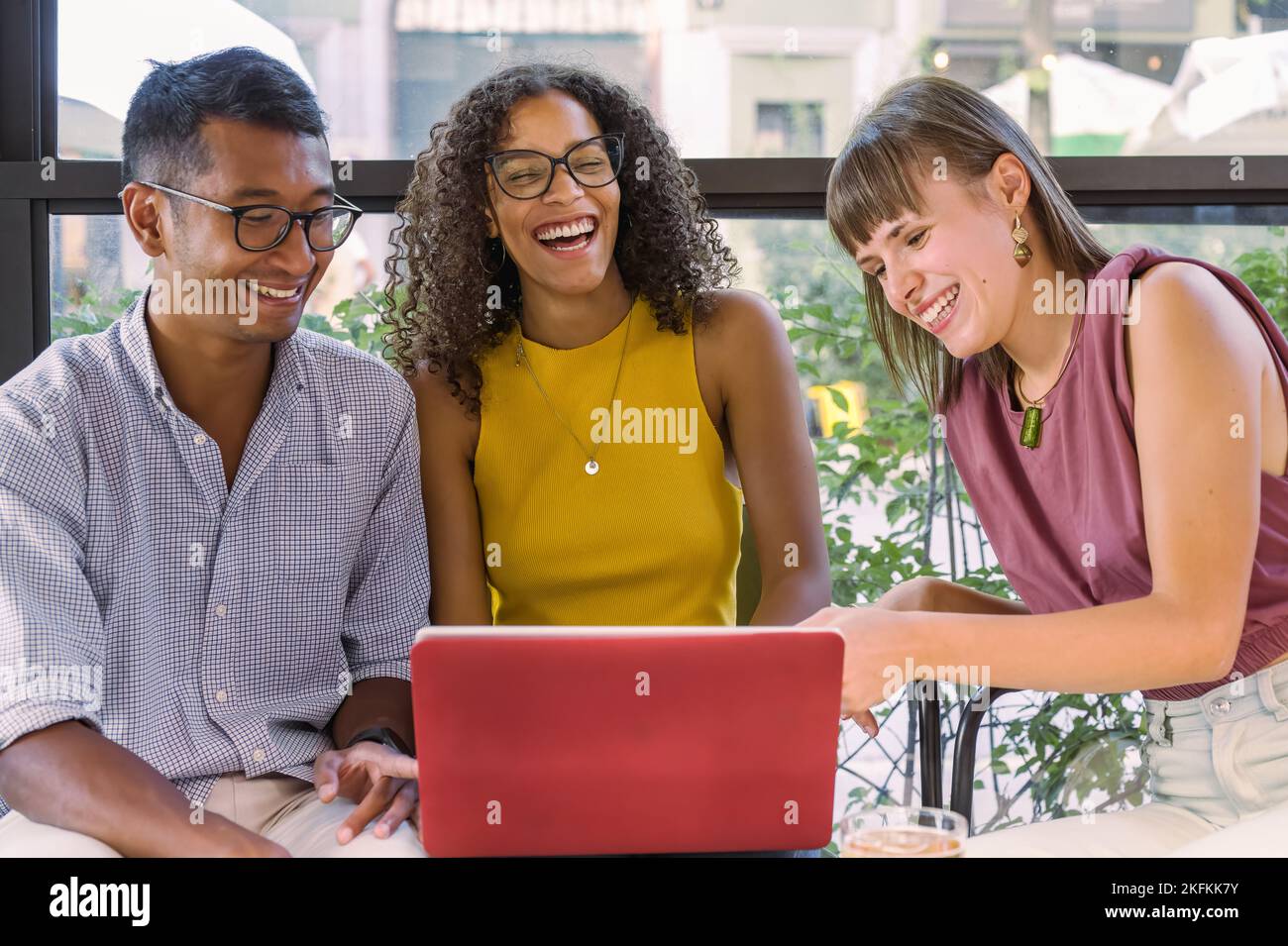 portrait of three excited students reading good news togheter on ...