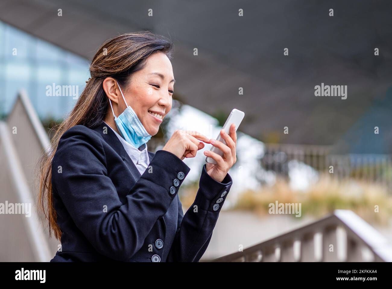 adult japanese business woman typing text on smartphone, female ...