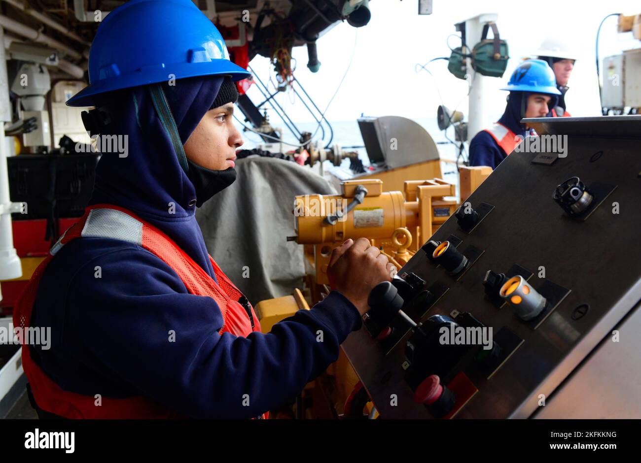Seaman Ricardo Castillo works the wench aboard USCGC Stratton (WMSL 752 ...