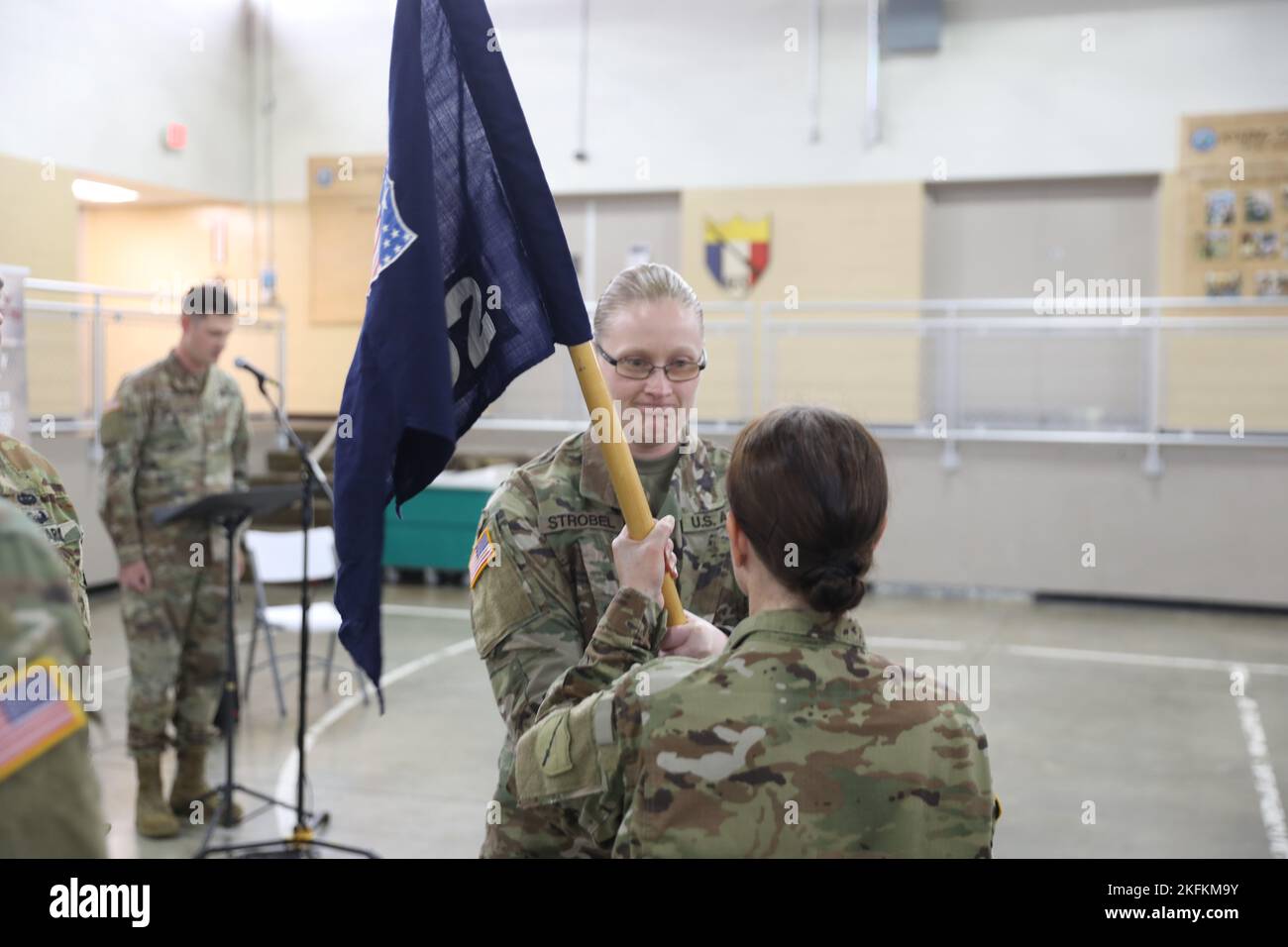 First Sgt. Angela Wilkins hands the guide on to Warrant Officer ...