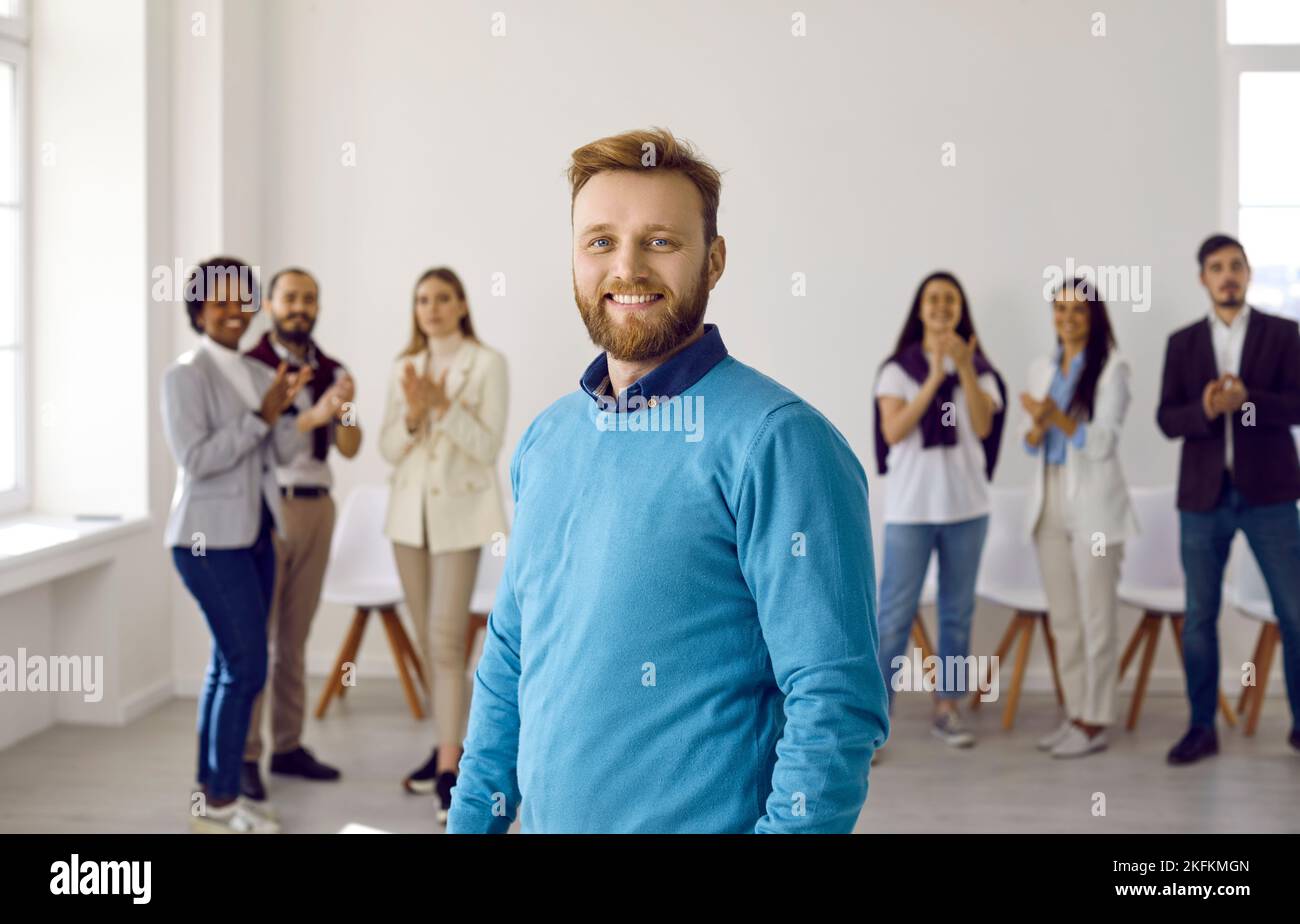 Portrait of smiling successful businessman with team on back Stock ...