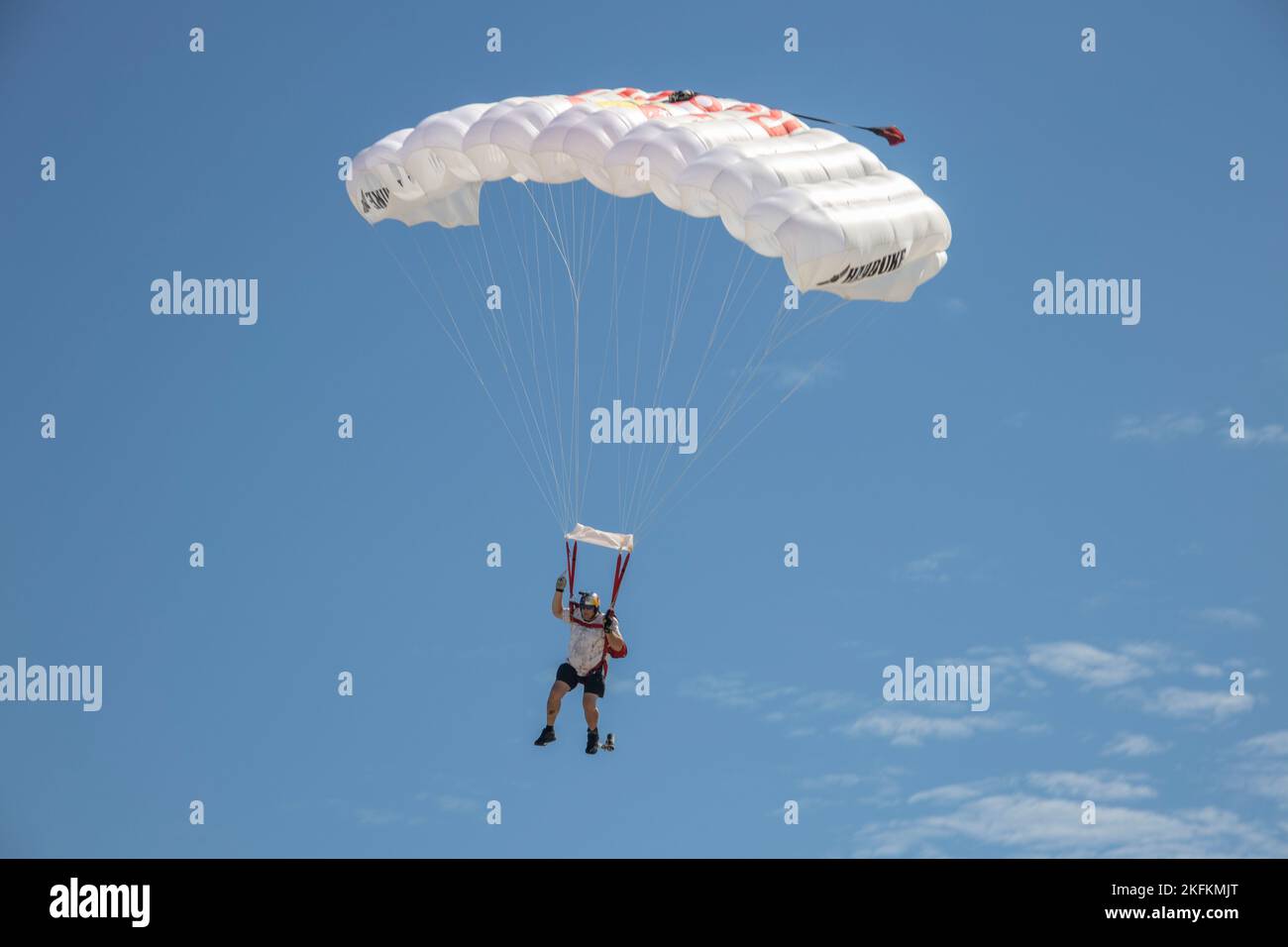 A member of the Red Bull Air Force team conducts an aerial jump out of ...