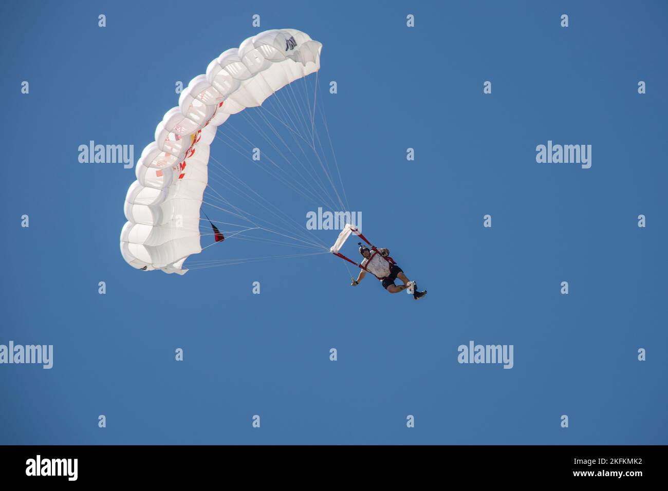 A member of the Red Bull Air Force team conducts an aerial jump out of ...