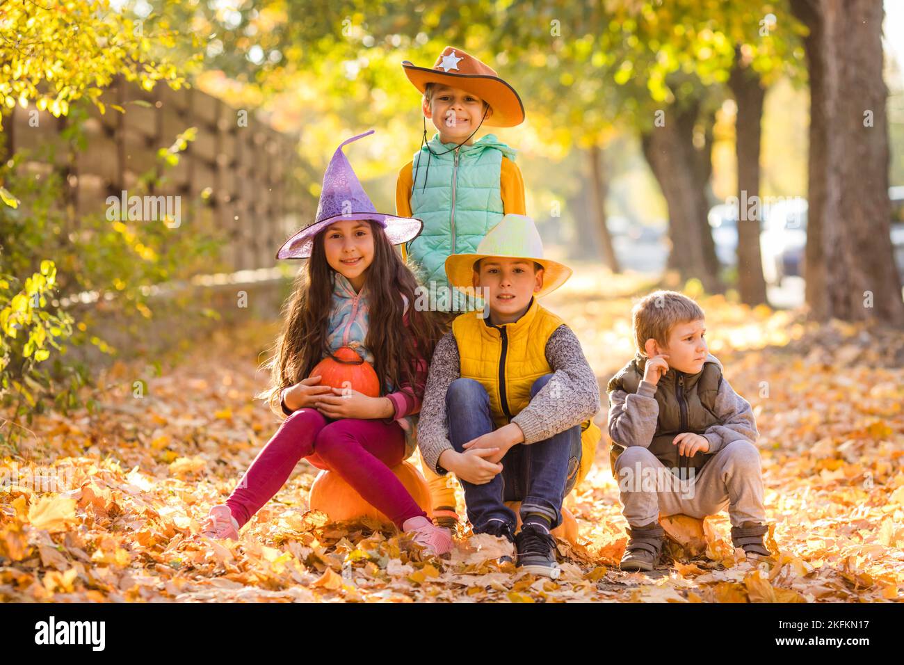 Group of little kids enjoying harvest festival celebration at pumpkin ...