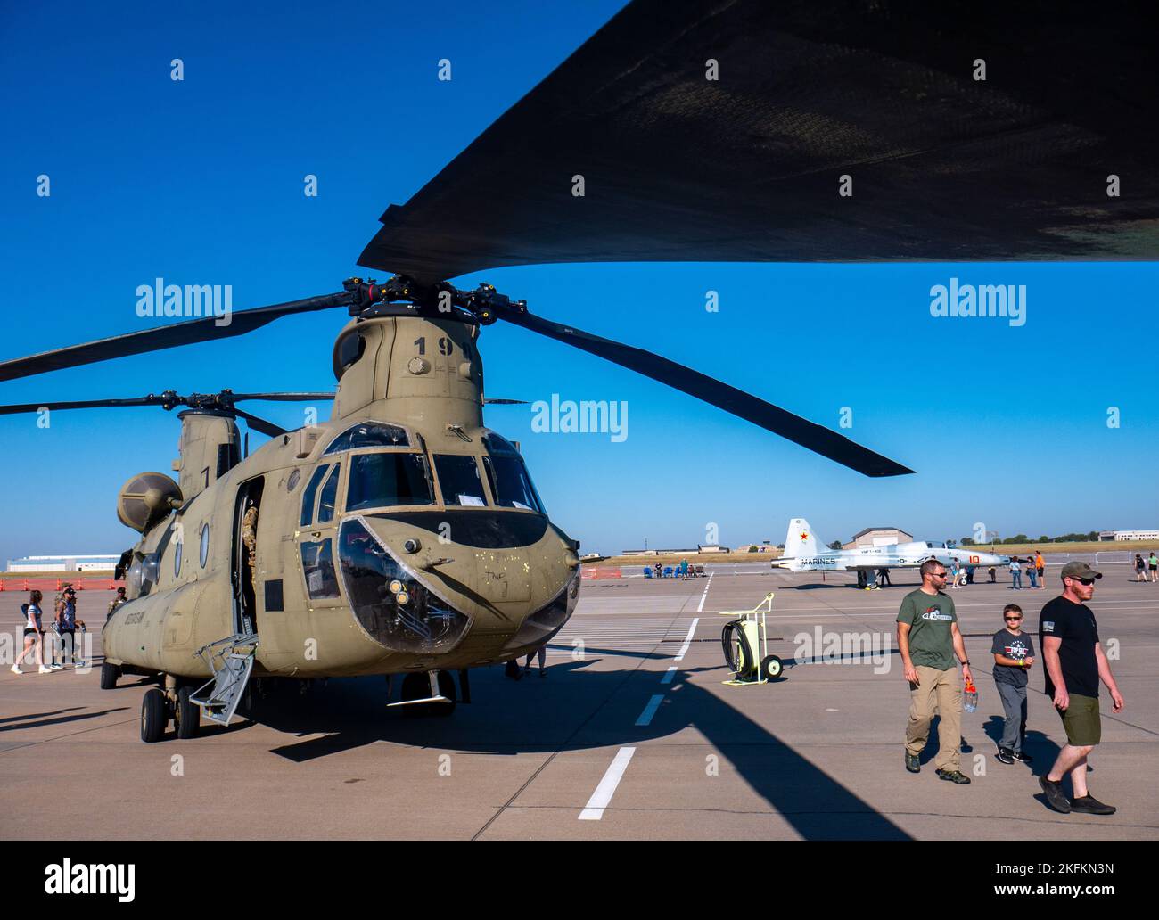 Guests to the Annual Frontiers In Flight Airshow walk by a CH-47 ...