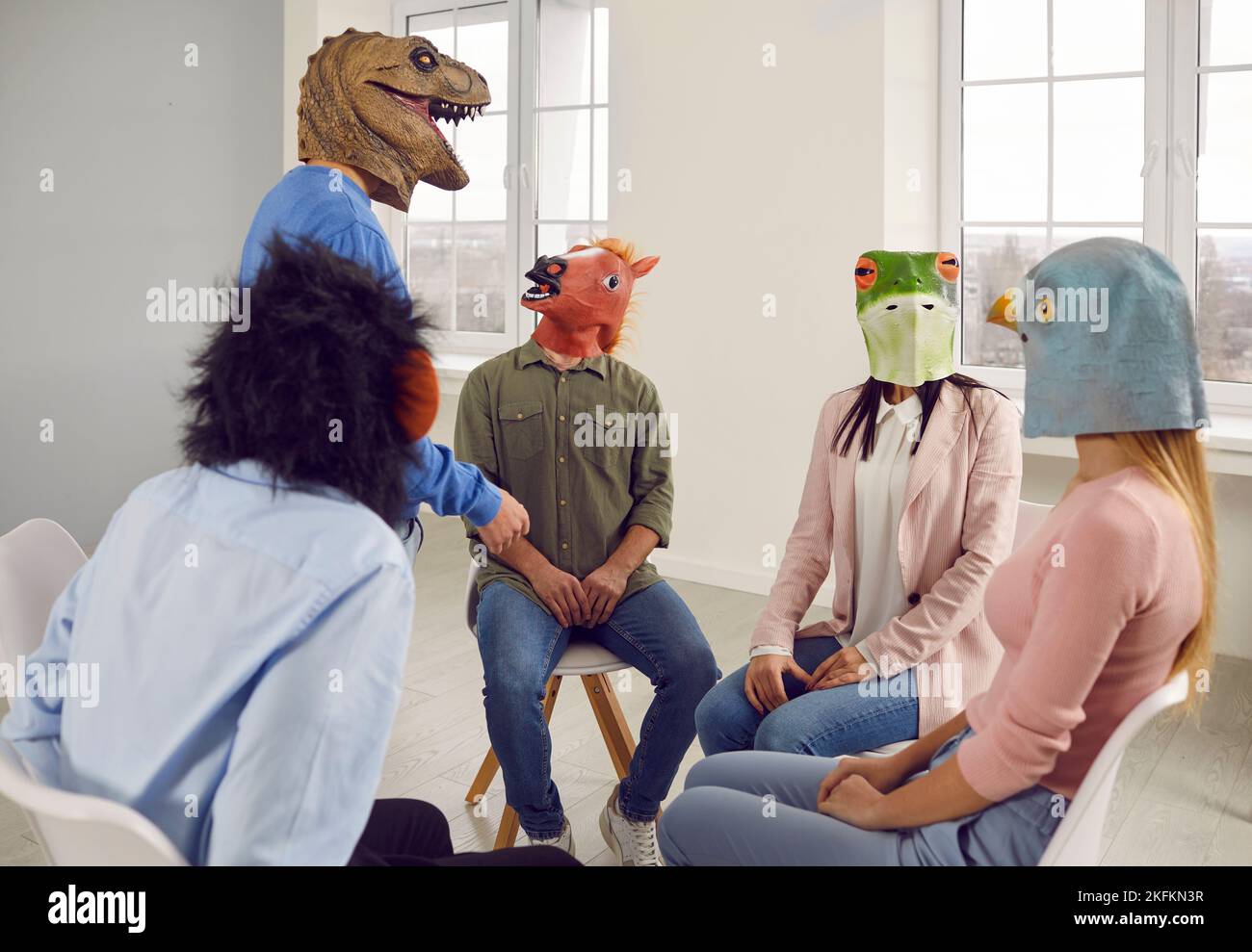 Patients wearing funny animal masks meeting at a group therapy session ...