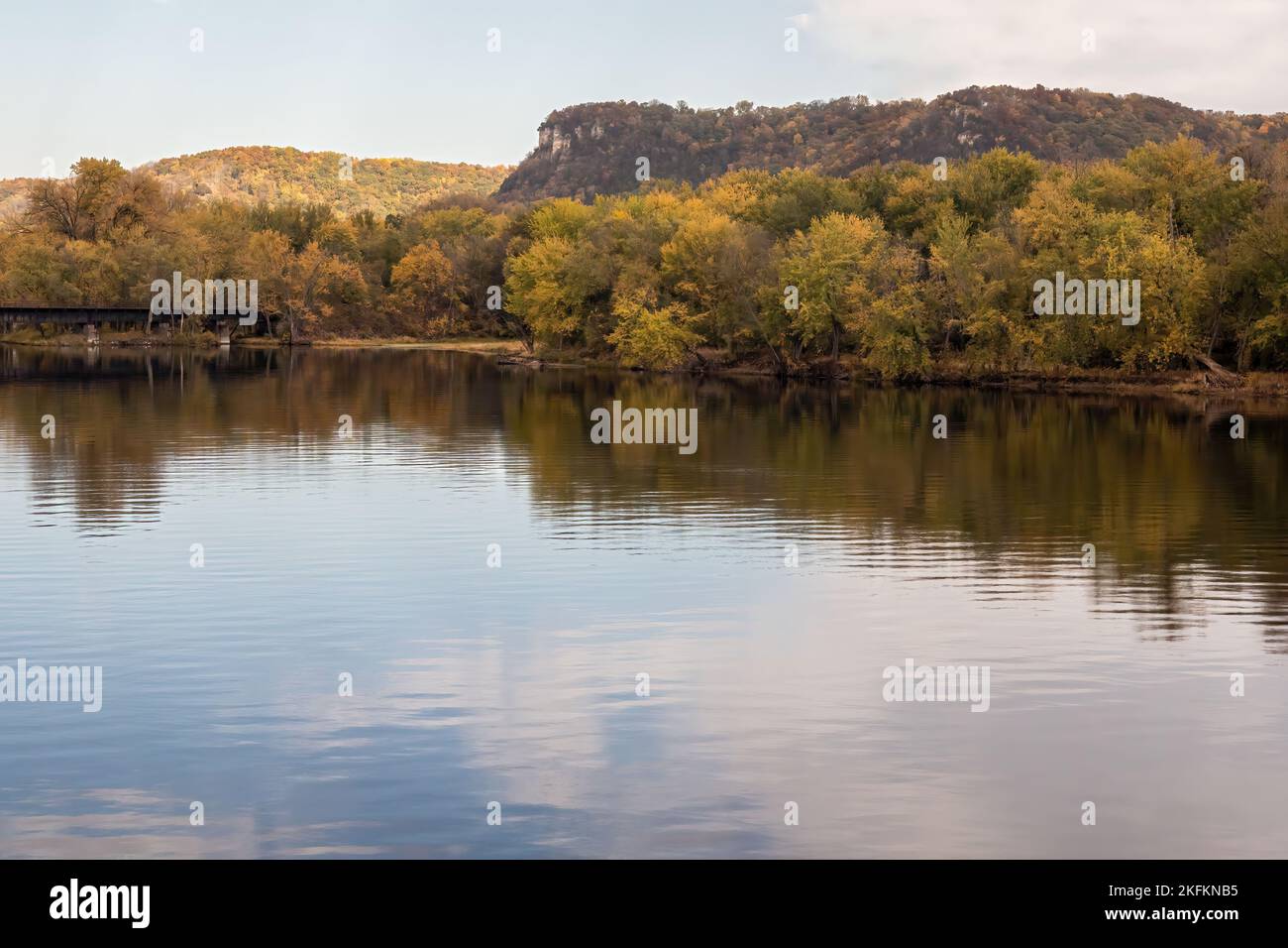 Limestone cliffs and fall colors on the surrounding hills and trees ...