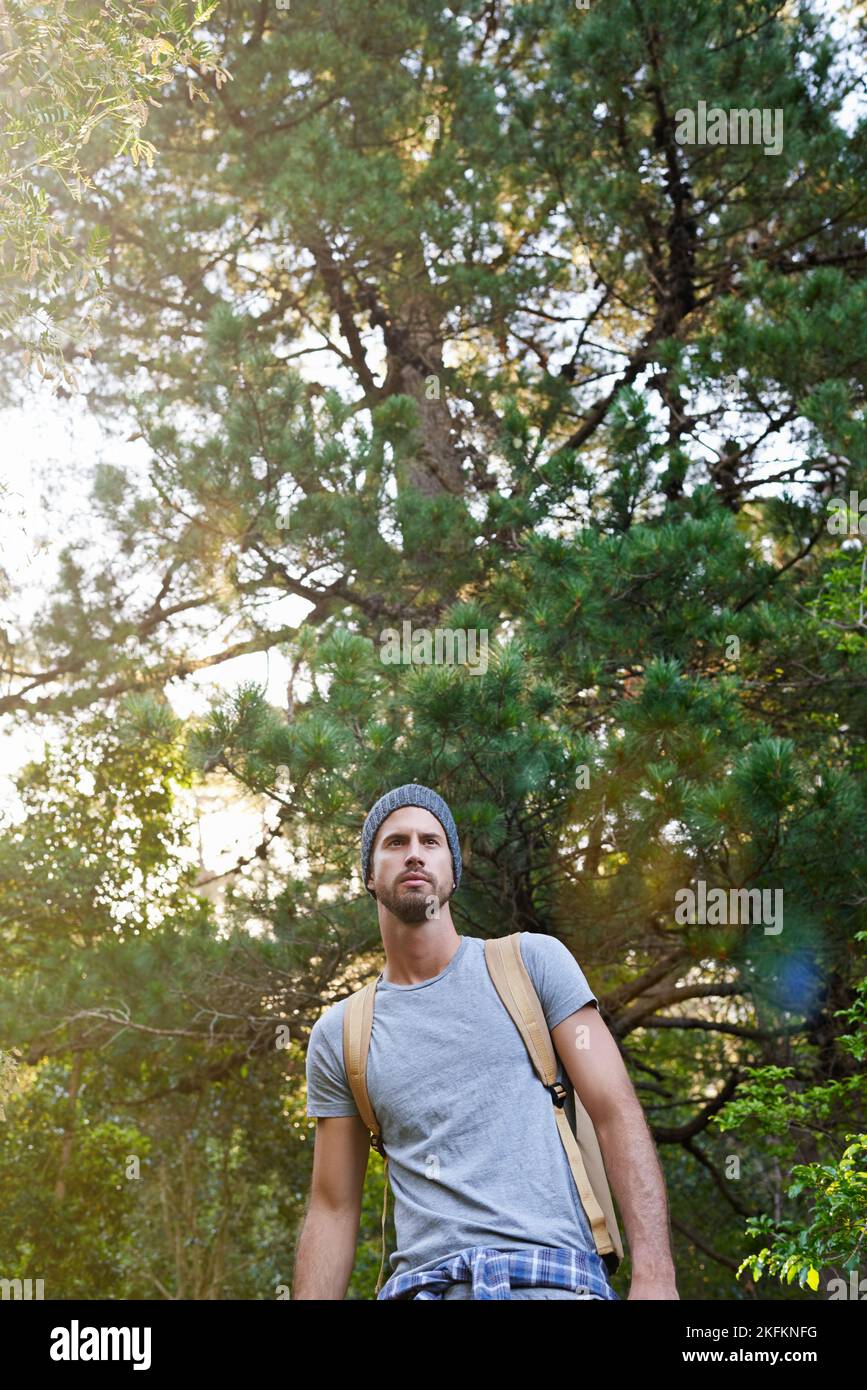 Only one who wanders finds new paths. A young man looking at the nature ...