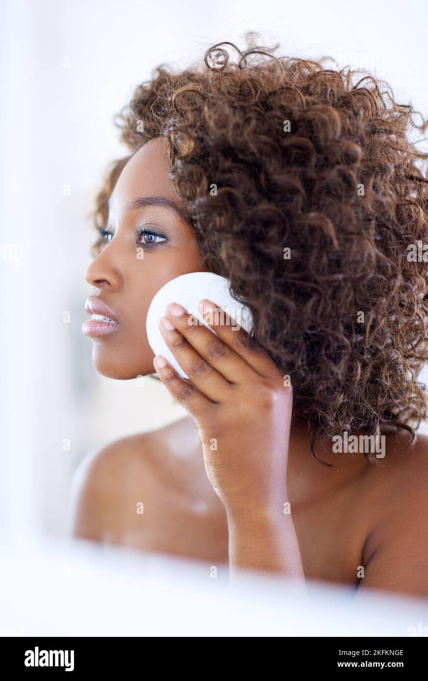 Take time out for beauty. a beautiful young woman during her daily ...