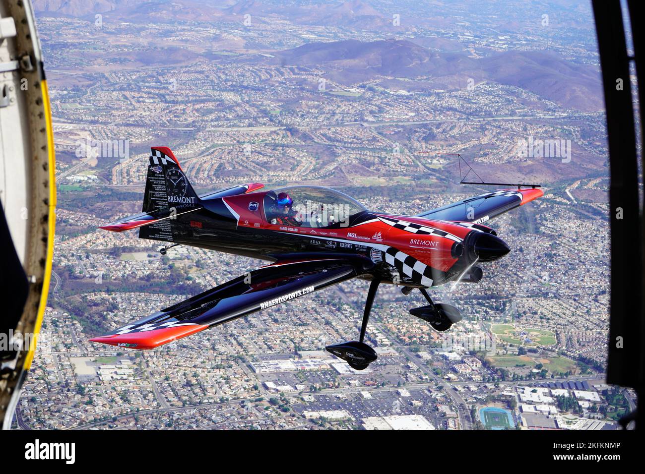 Rob Holland, piloting his MXS-RH, next to the Golden Knights, performs ...