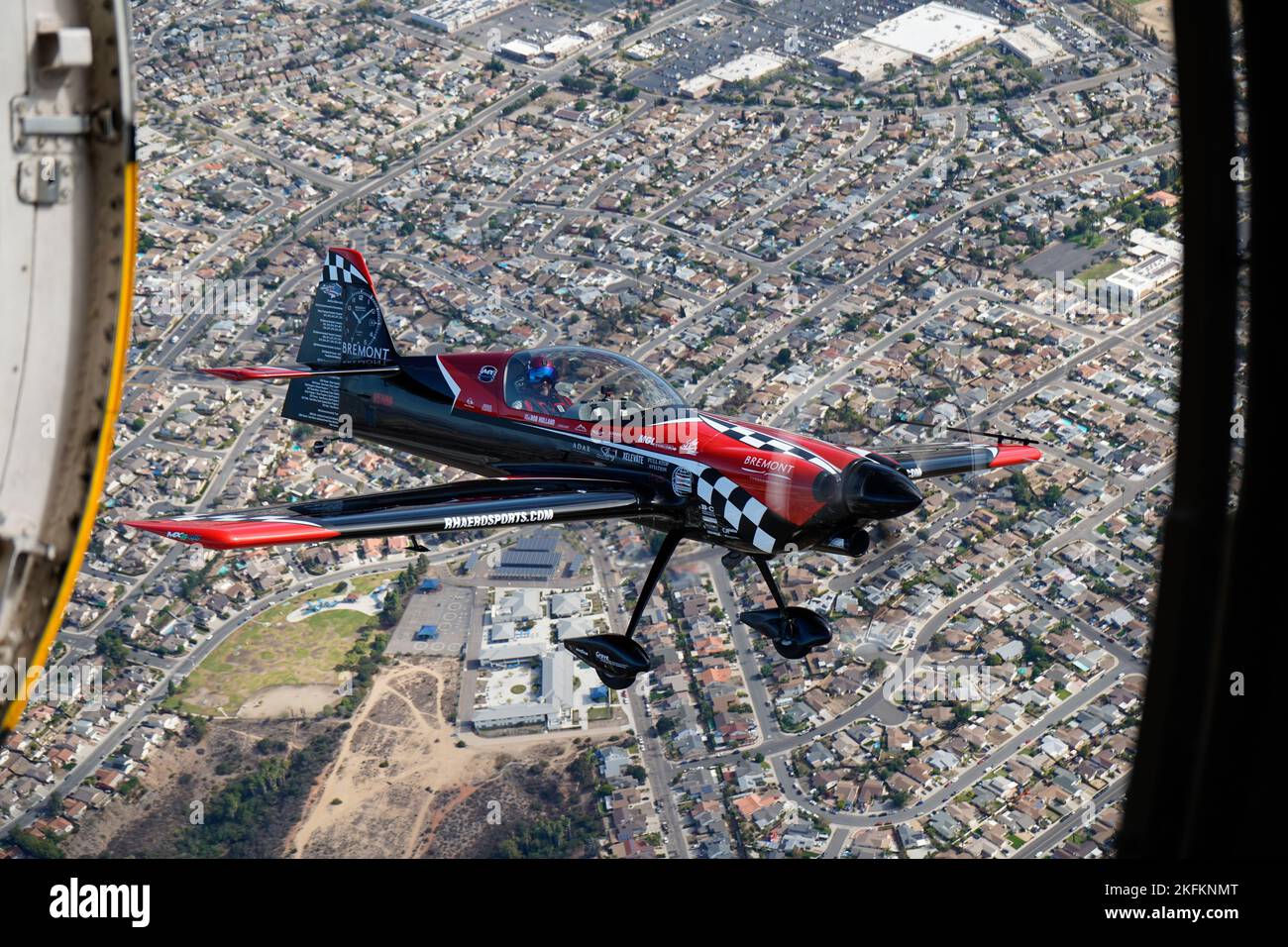 Rob Holland, piloting his MXS-RH, next to the Golden Knights, performs ...