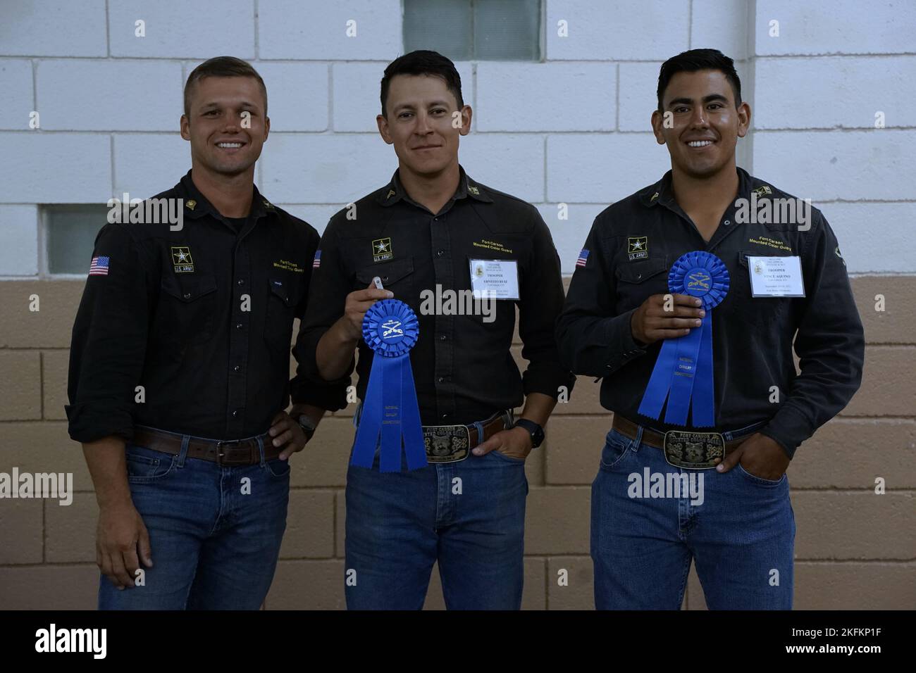 The Fort Carson Mountain Color Guard (FCMCG) winners, hold up their ...