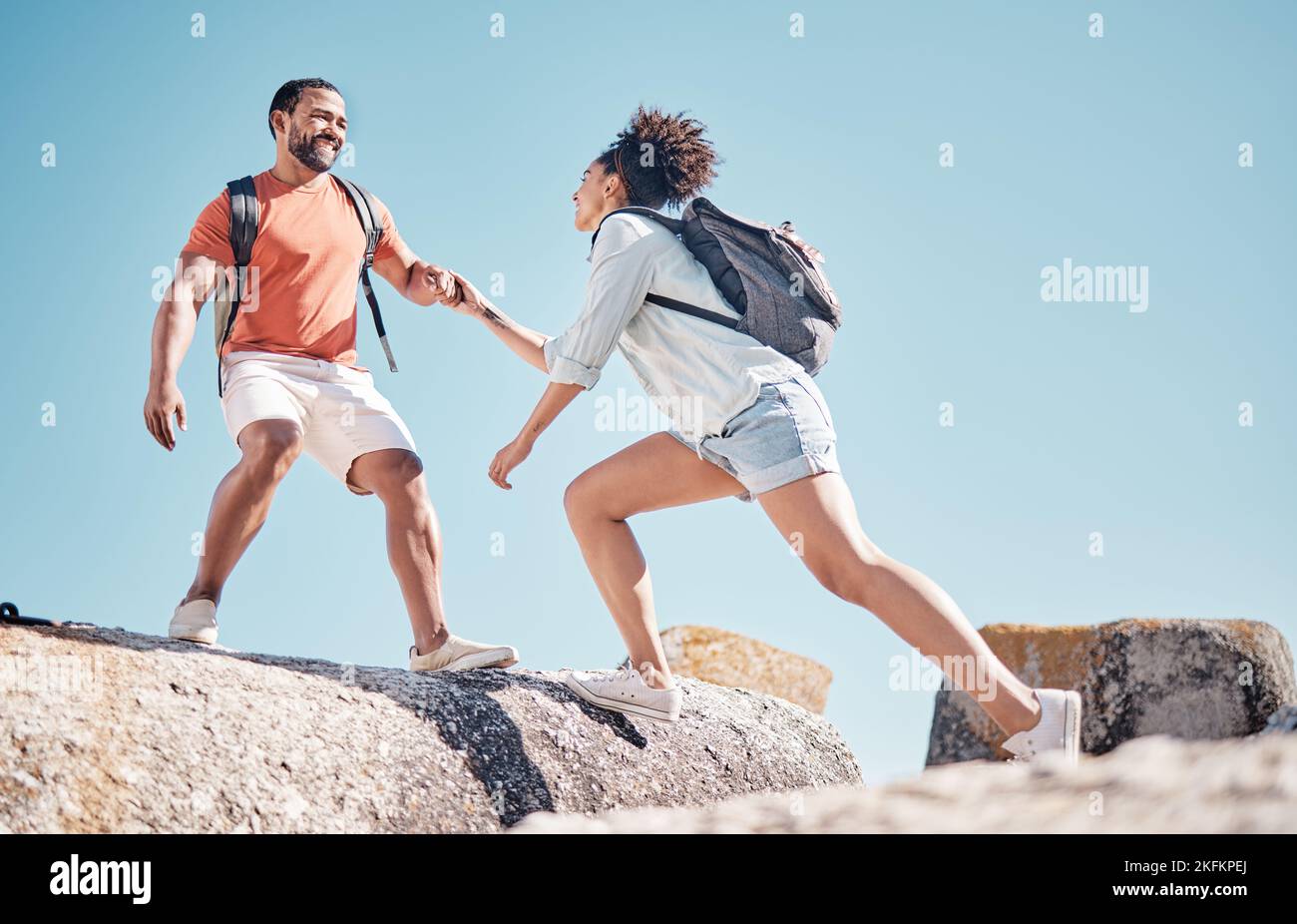 Helping hand mountain climbing hi-res stock photography and images - Alamy