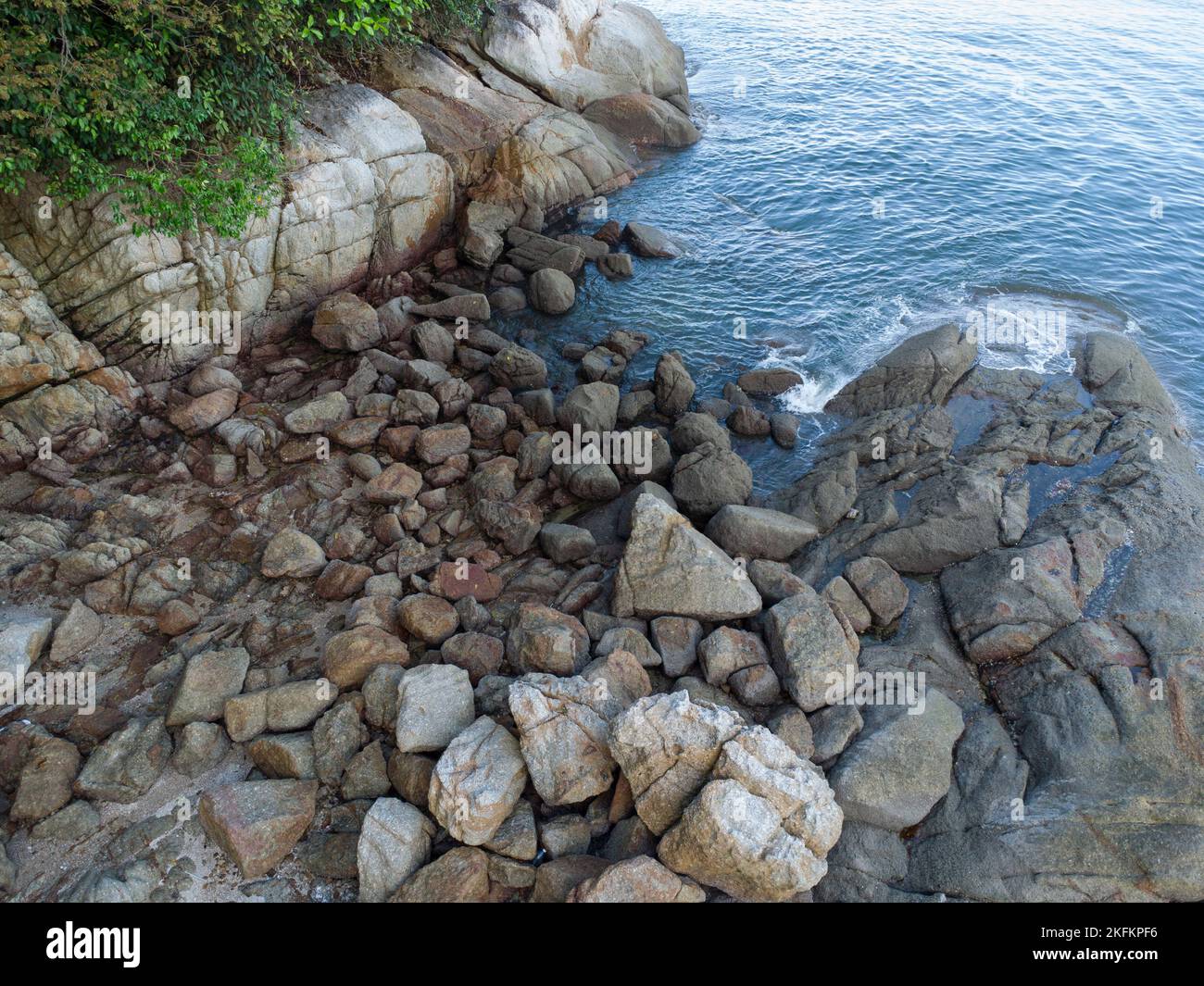 aerial image of the beach with lots of granite rocks Stock Photo - Alamy