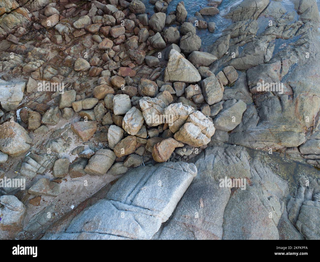 aerial image of the beach with lots of granite rocks Stock Photo - Alamy