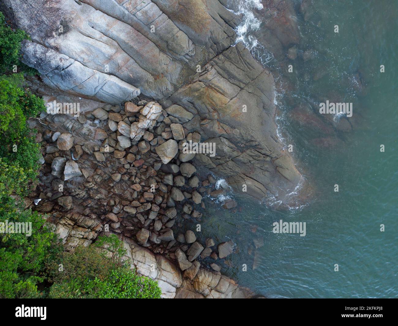 aerial image of the beach with lots of granite rocks Stock Photo - Alamy