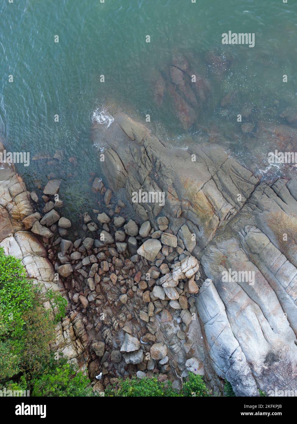 aerial image of the beach with lots of granite rocks Stock Photo - Alamy