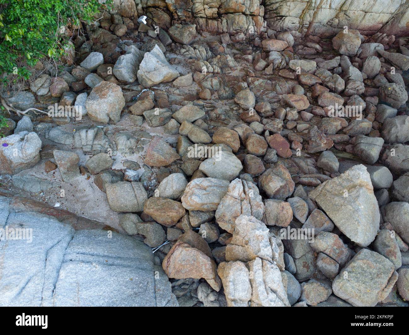 aerial image of the beach with lots of granite rocks Stock Photo - Alamy