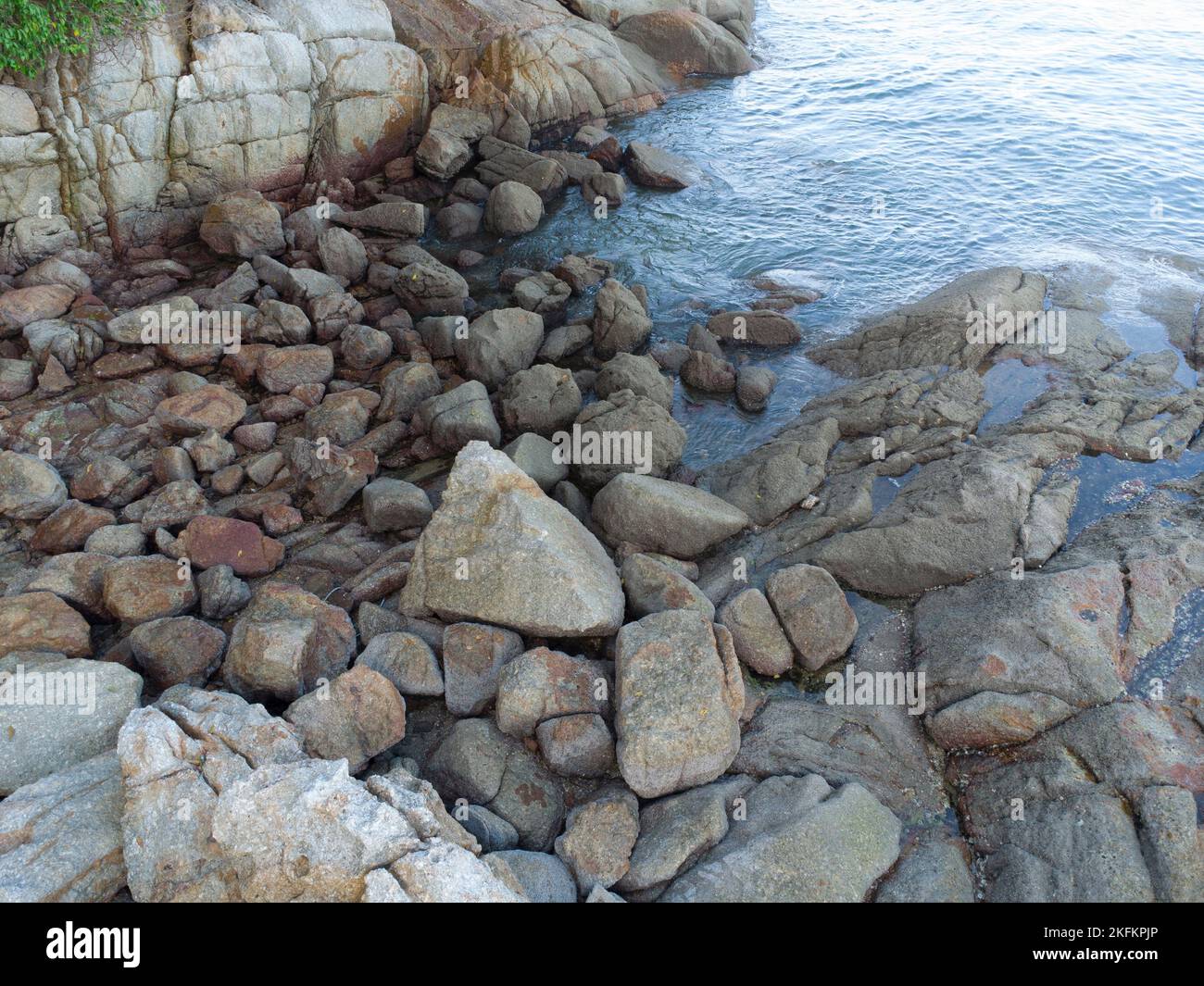 aerial image of the beach with lots of granite rocks Stock Photo - Alamy