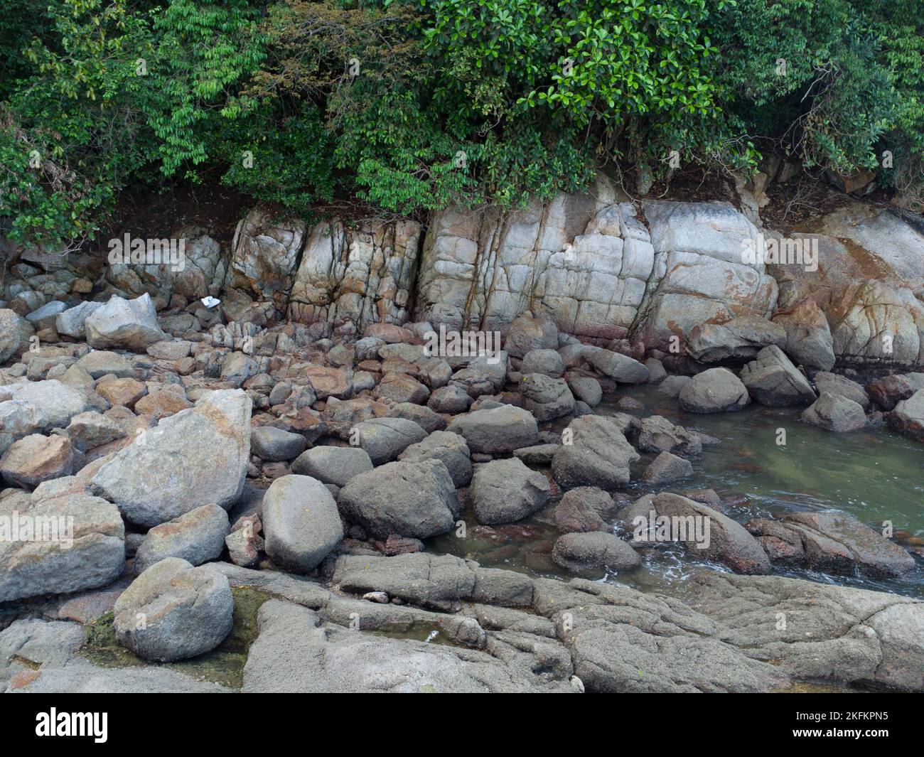 aerial image of the beach with lots of granite rocks Stock Photo - Alamy