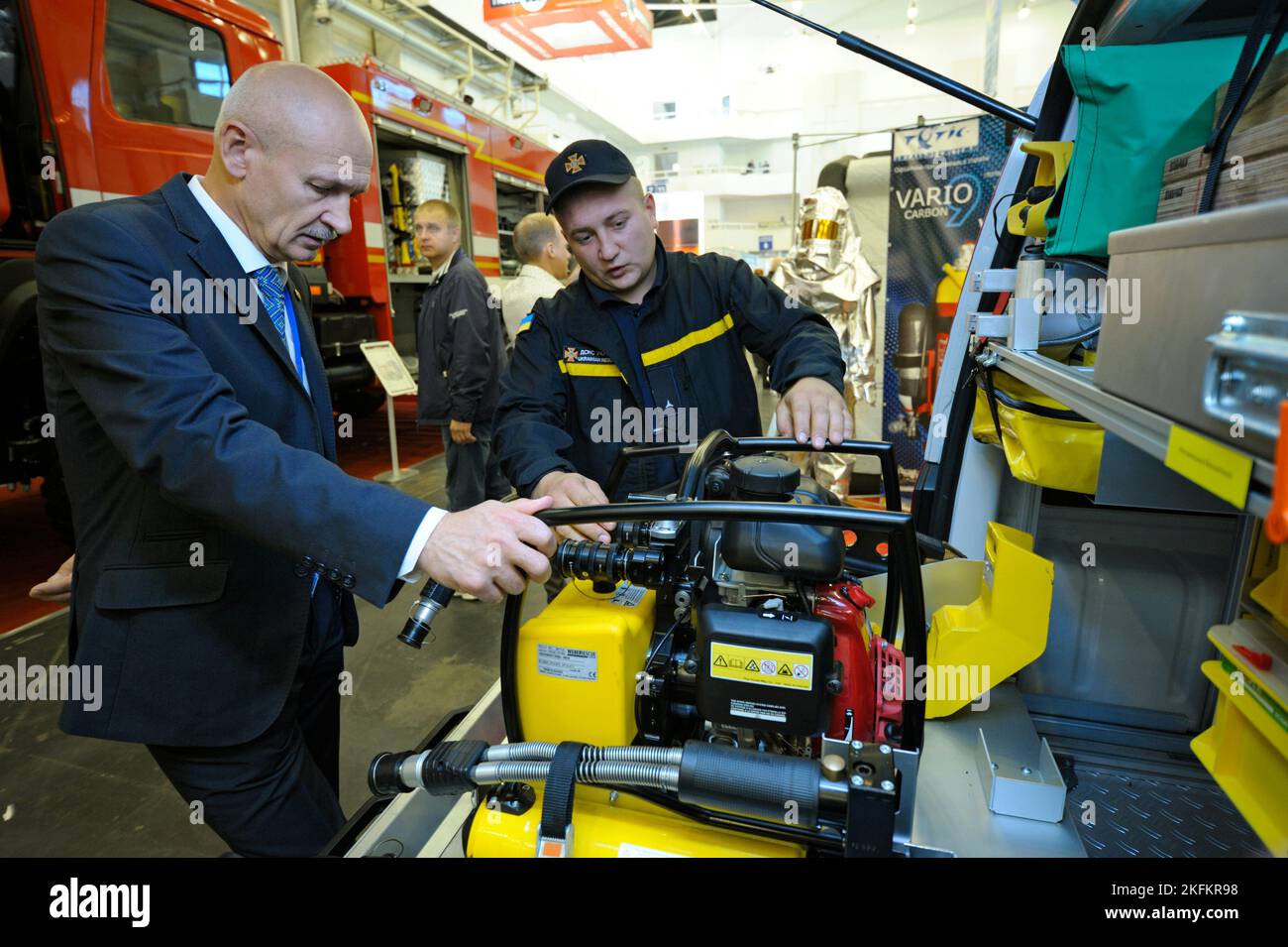 Managers discussing equipment for technical rescue and support, compact ...