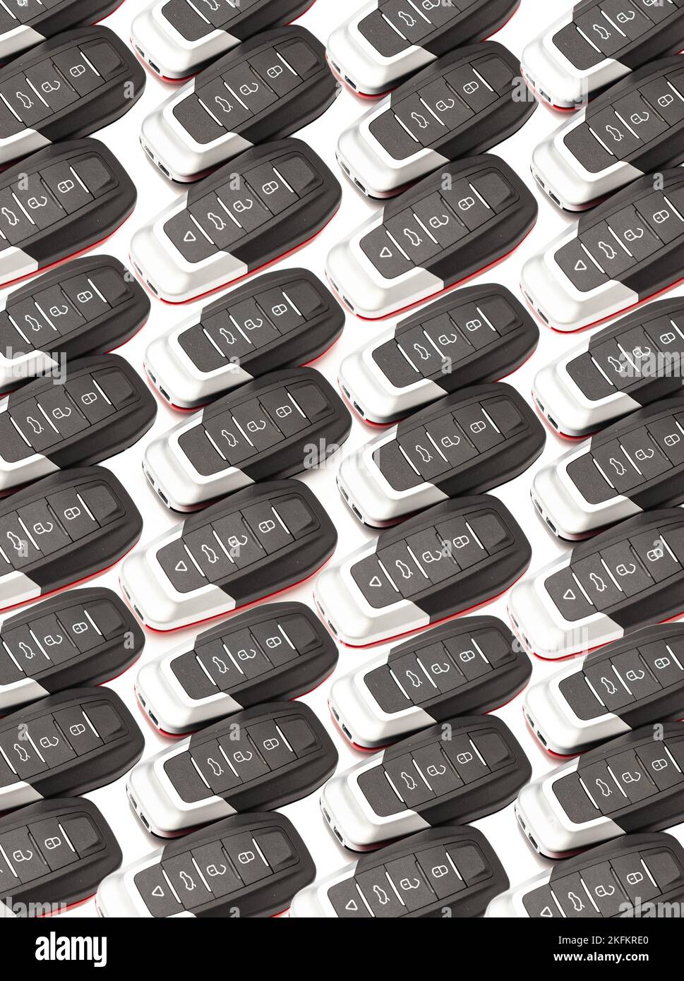 Car keys lie in different poses on a white background. Black and red ...