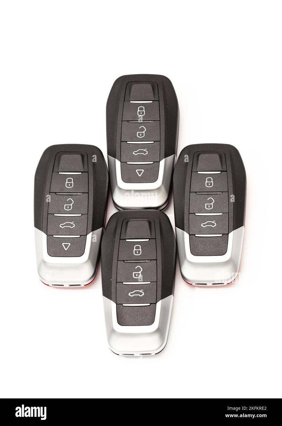 Car keys lie in different poses on a white background. Black and red ...