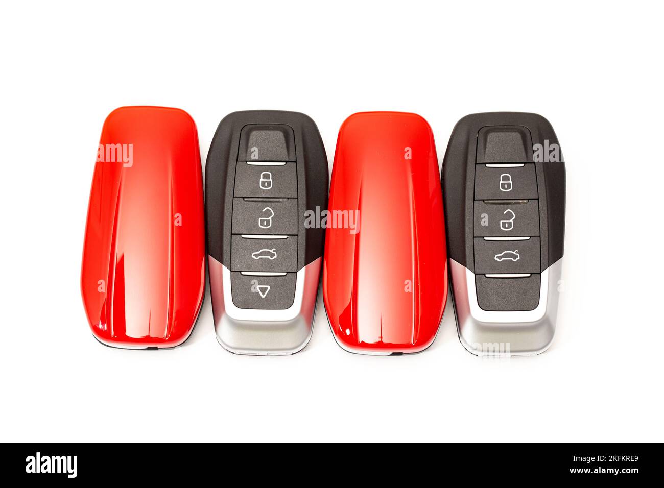 Car keys lie in different poses on a white background. Black and red ...