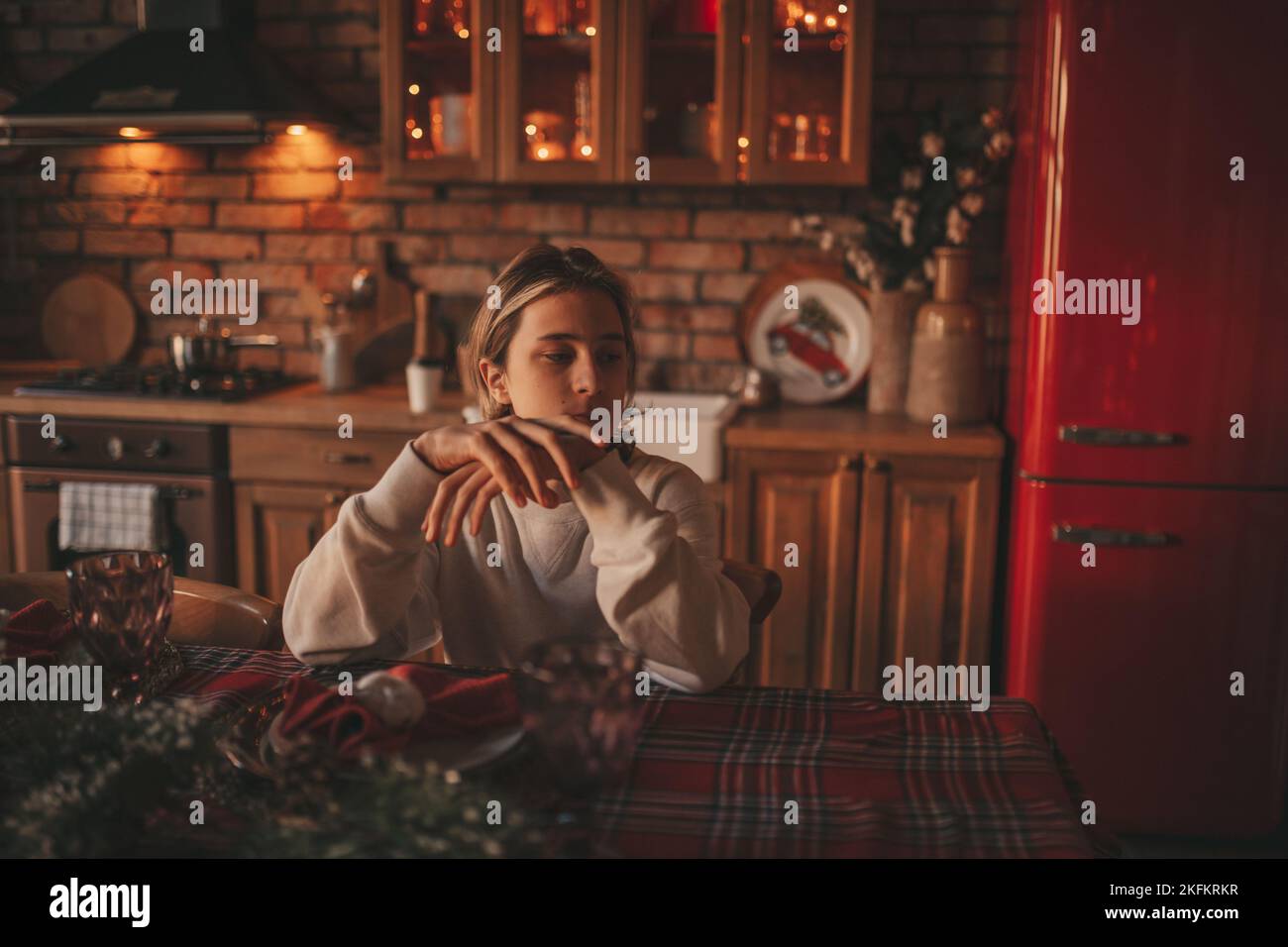 Young teen boy with long hair thoughtful look sad eyes negative mood ...