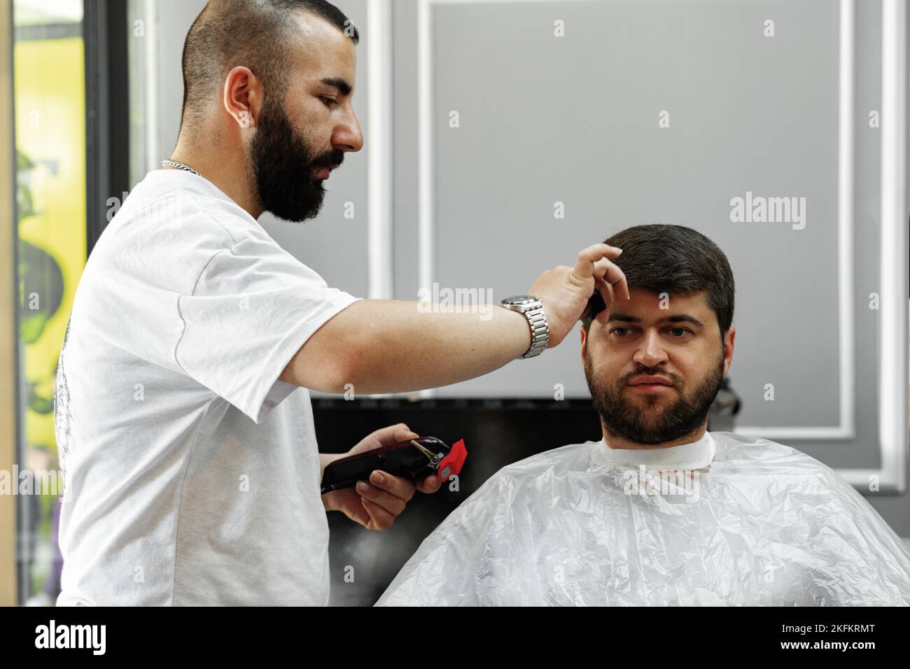 ISTANBUL, TURKEY - MAY 16, 2022: Hairstylist doing haircut for client ...