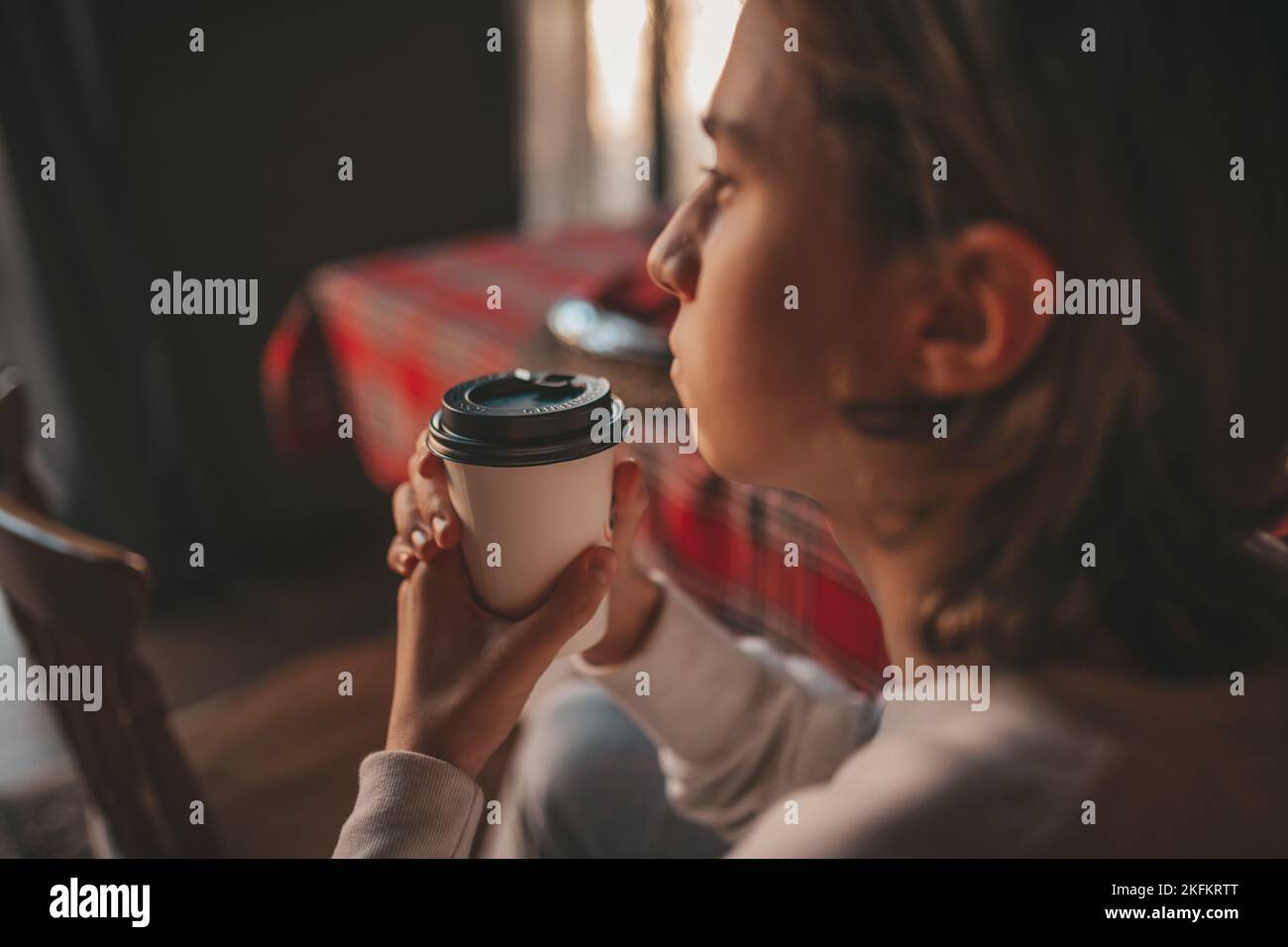 Young teen boy with long hair thoughtful look sad eyes negative mood ...