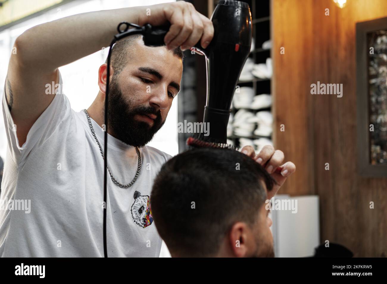 ISTANBUL, TURKEY - MAY 16, 2022: Hairstylist doing haircut for client ...