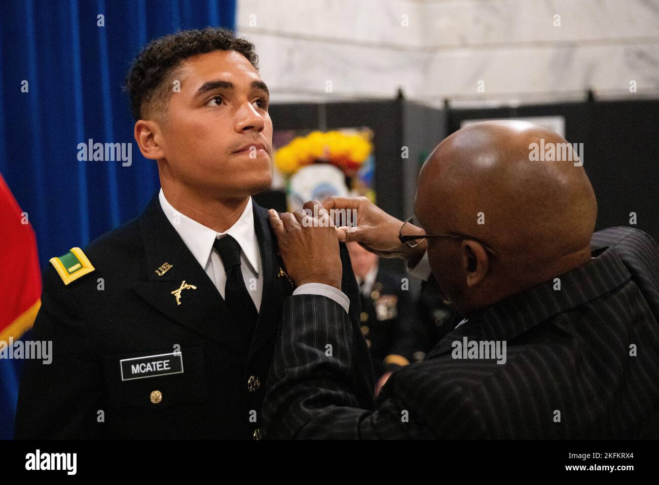 Army officer candidate Tevin McAtee is pinned second lieutenant by his ...