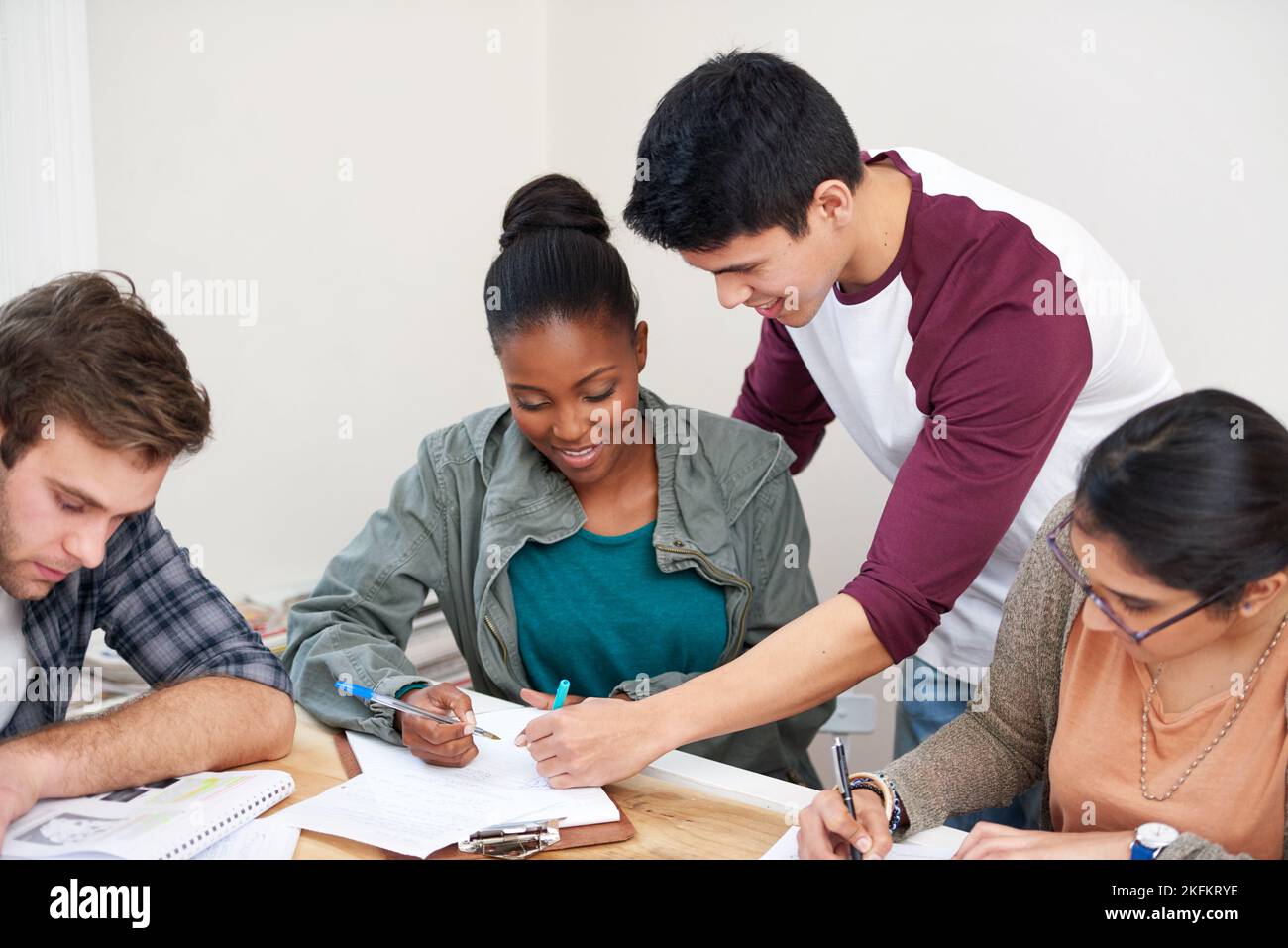 Showing her the ropes. a group of university students in a study group ...