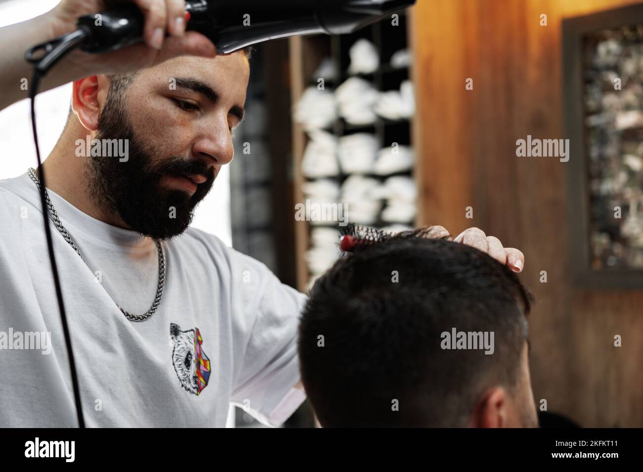 ISTANBUL, TURKEY - MAY 16, 2022: Hairstylist doing haircut for client ...