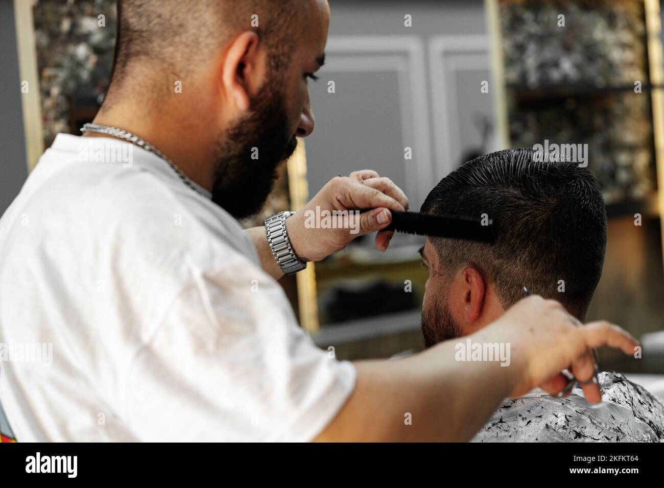 ISTANBUL, TURKEY - MAY 16, 2022: Hairstylist doing haircut for client ...