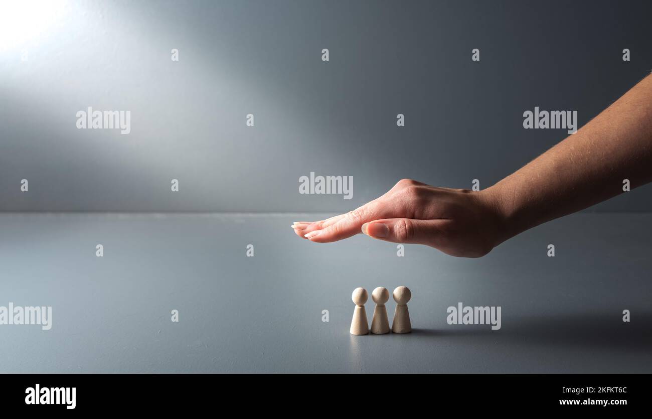 hand protecting the family gray background , Family care concept ,Home ...