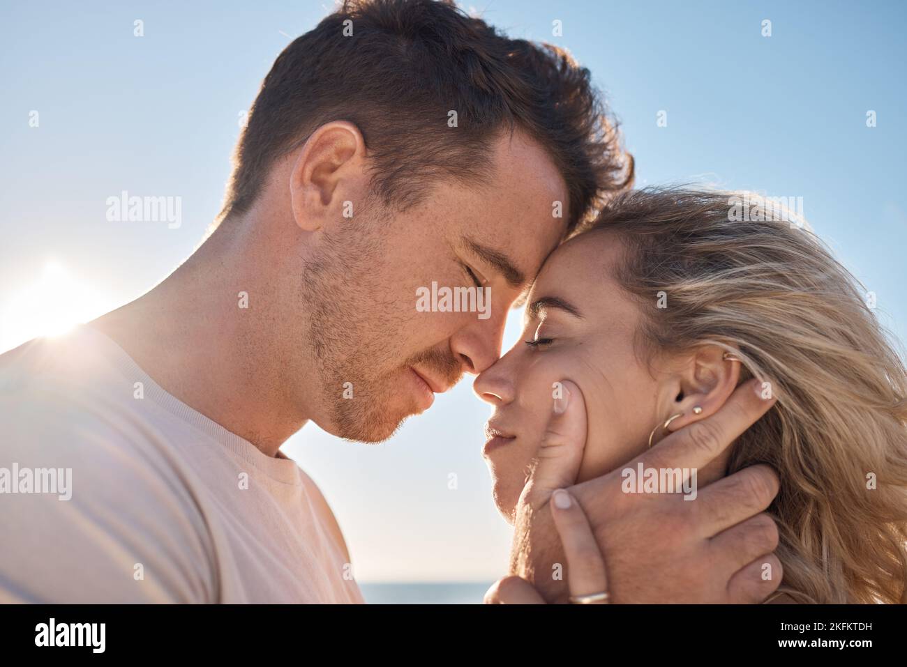 Couple, head touch and love at beach in closeup with romance, care and ...
