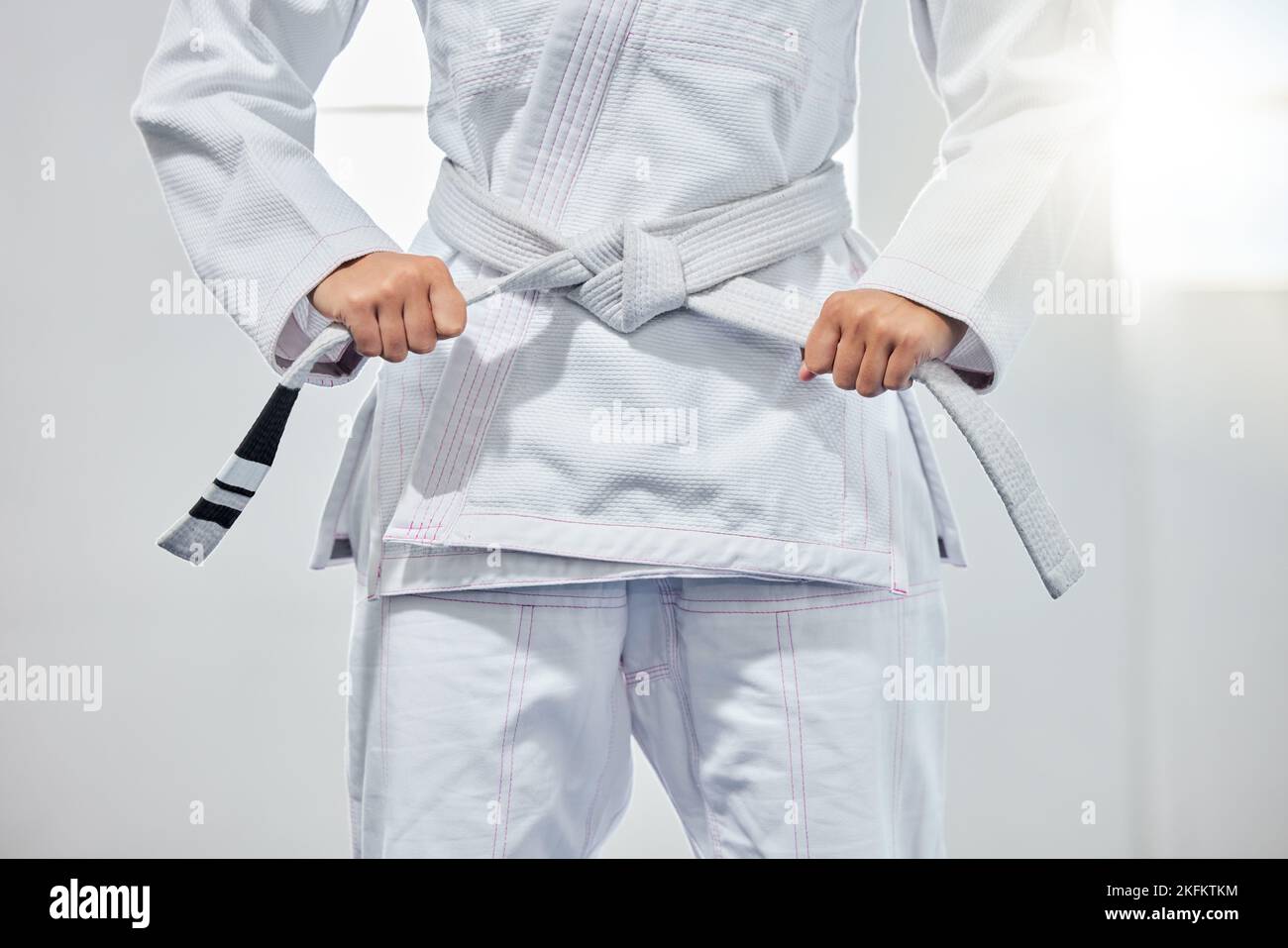 karate belt, martial arts and woman ready for fight battle, white dojo ...