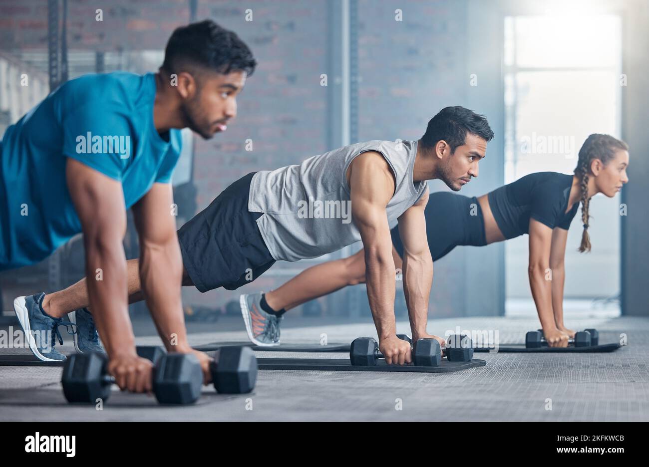 Fitness, teamwork and group with weights, focus and training for a body ...