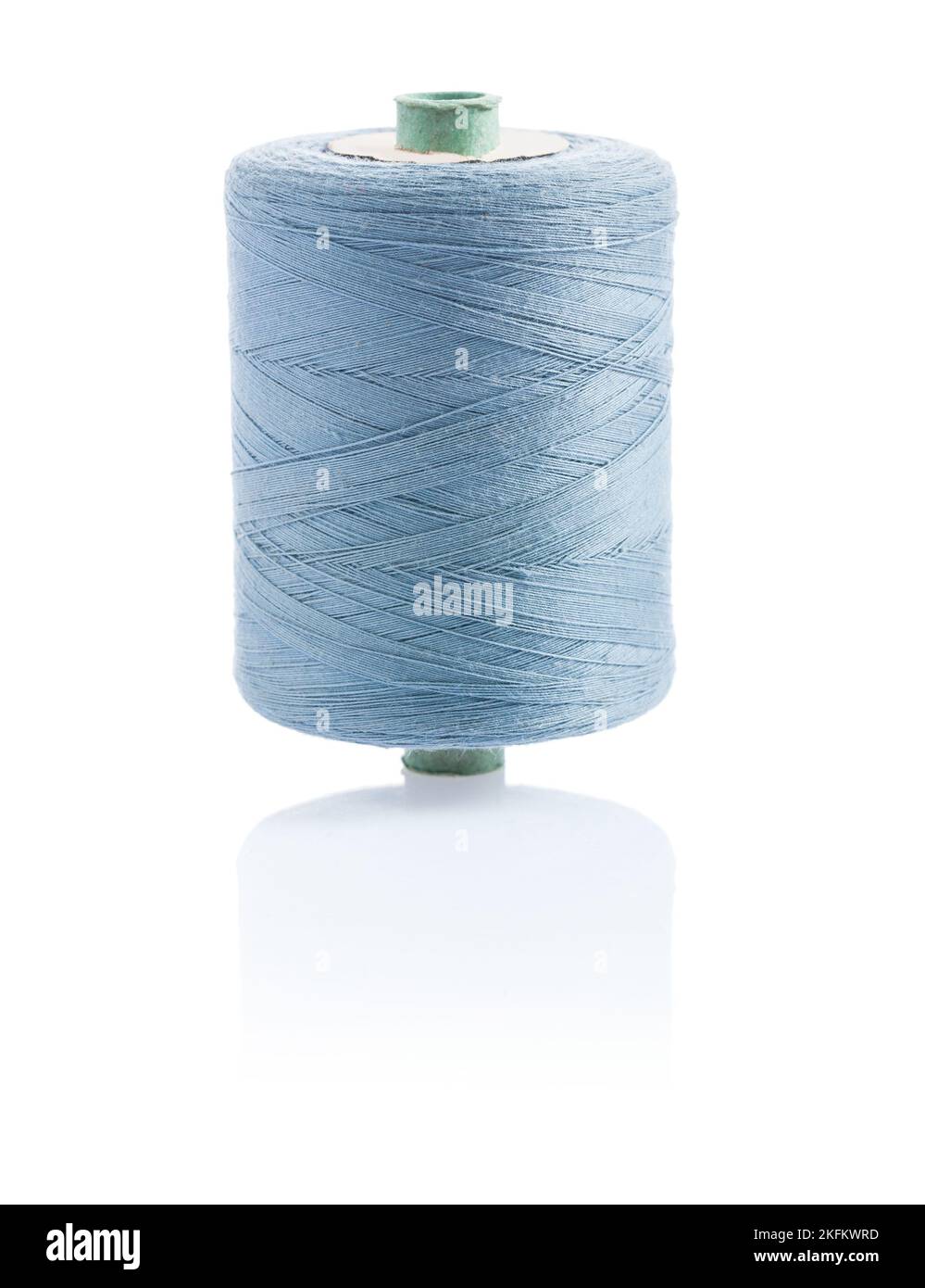 a bobbin with gray sewing string Stock Photo - Alamy
